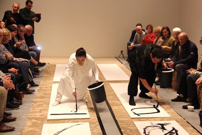 Japanese calligraphers demonstrate the art of Japanese calligraphy